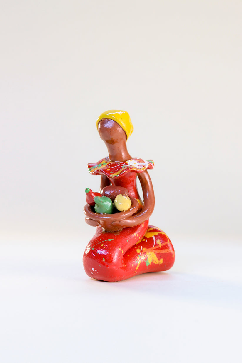 Muñecas arrodilladas – Manos Dominicanas